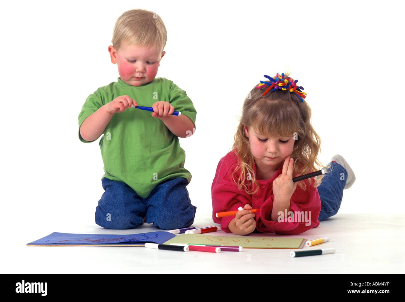 Two children are making a drawing Stock Photo - Alamy