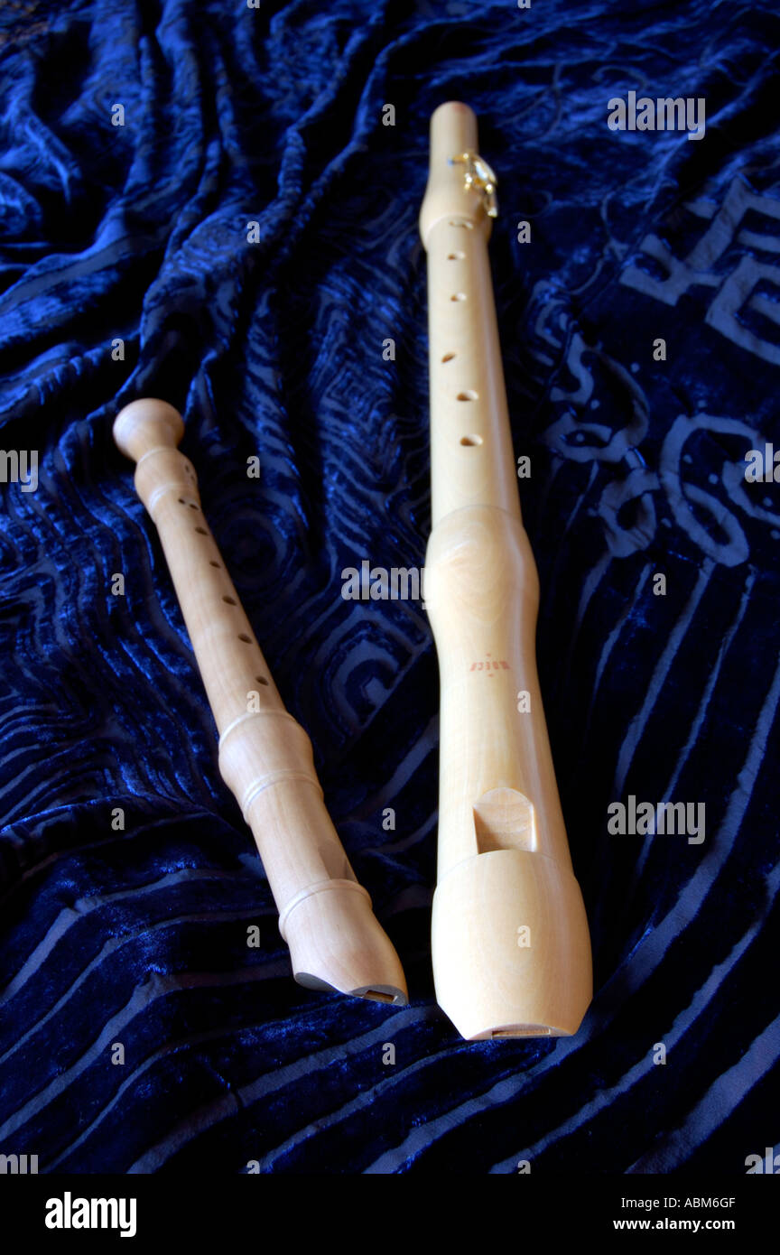 Descant and tenor recorders on a blue velvet background Stock Photo - Alamy