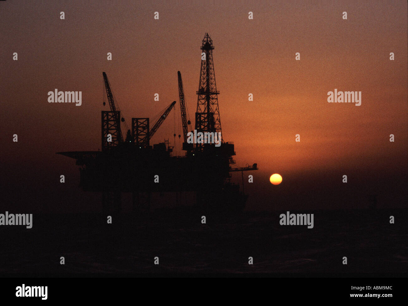 Oil rig and moon Stock Photo - Alamy