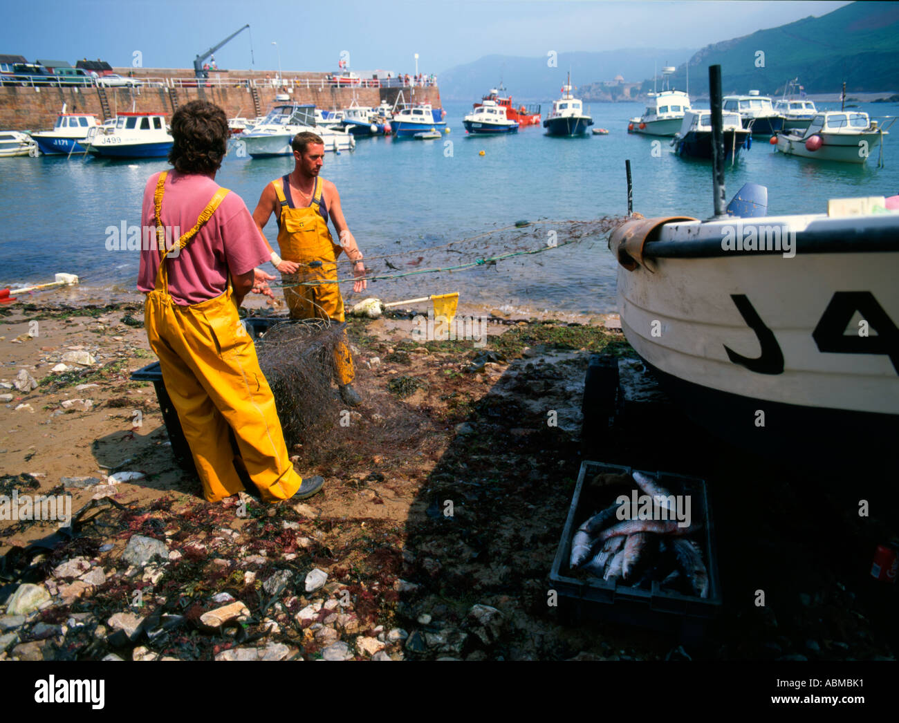 Fishermen hauling in nets sea hi-res stock photography and images - Alamy