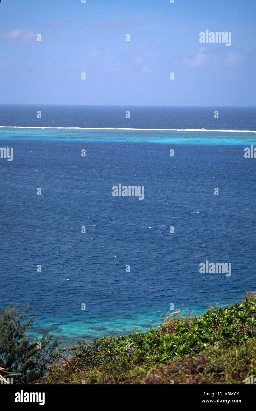 Astrolabe reef view from the shore with breaking waves at a distance ...