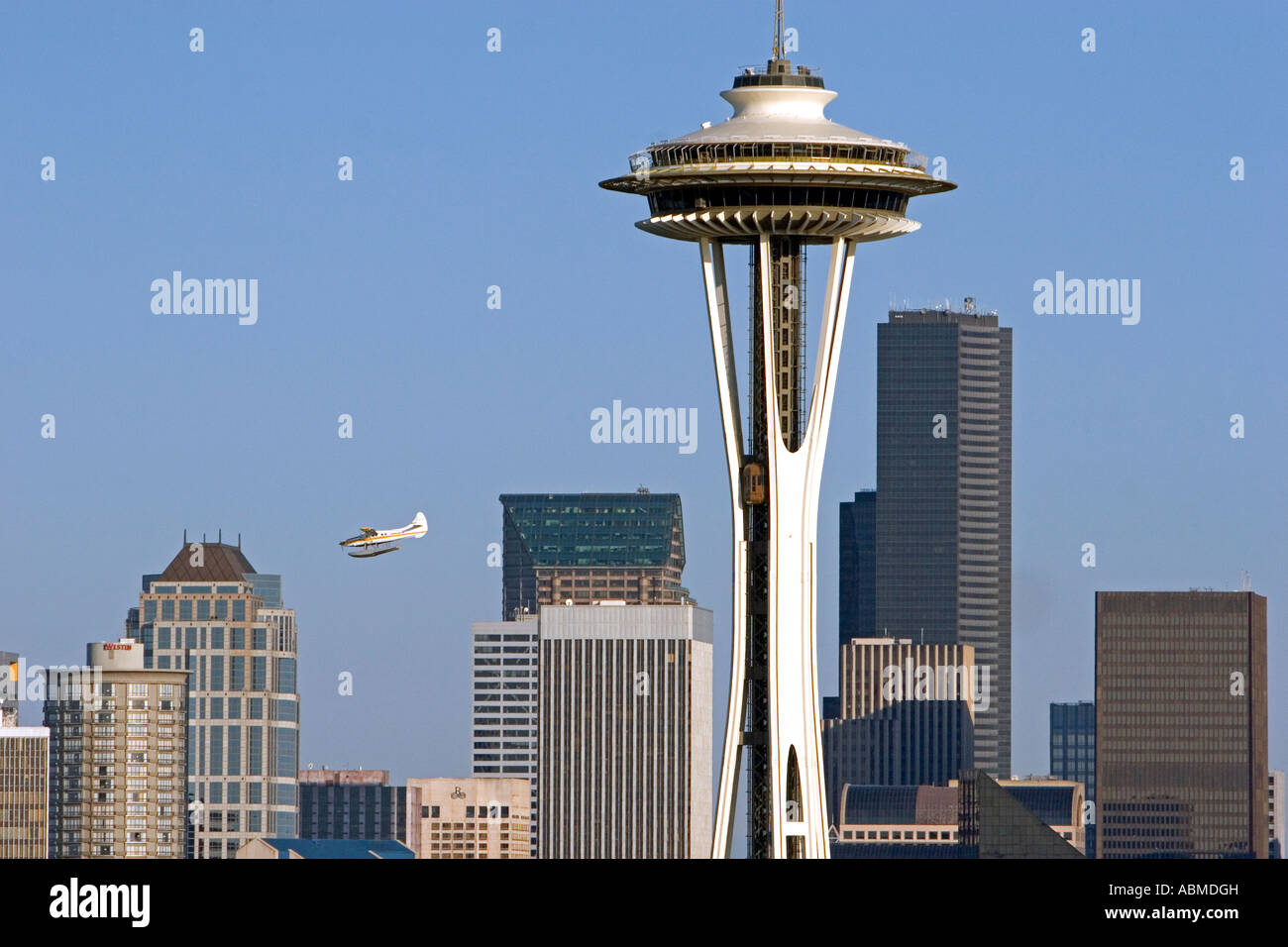 Sea plane flying over the city of Seattle and the Space Needle in ...