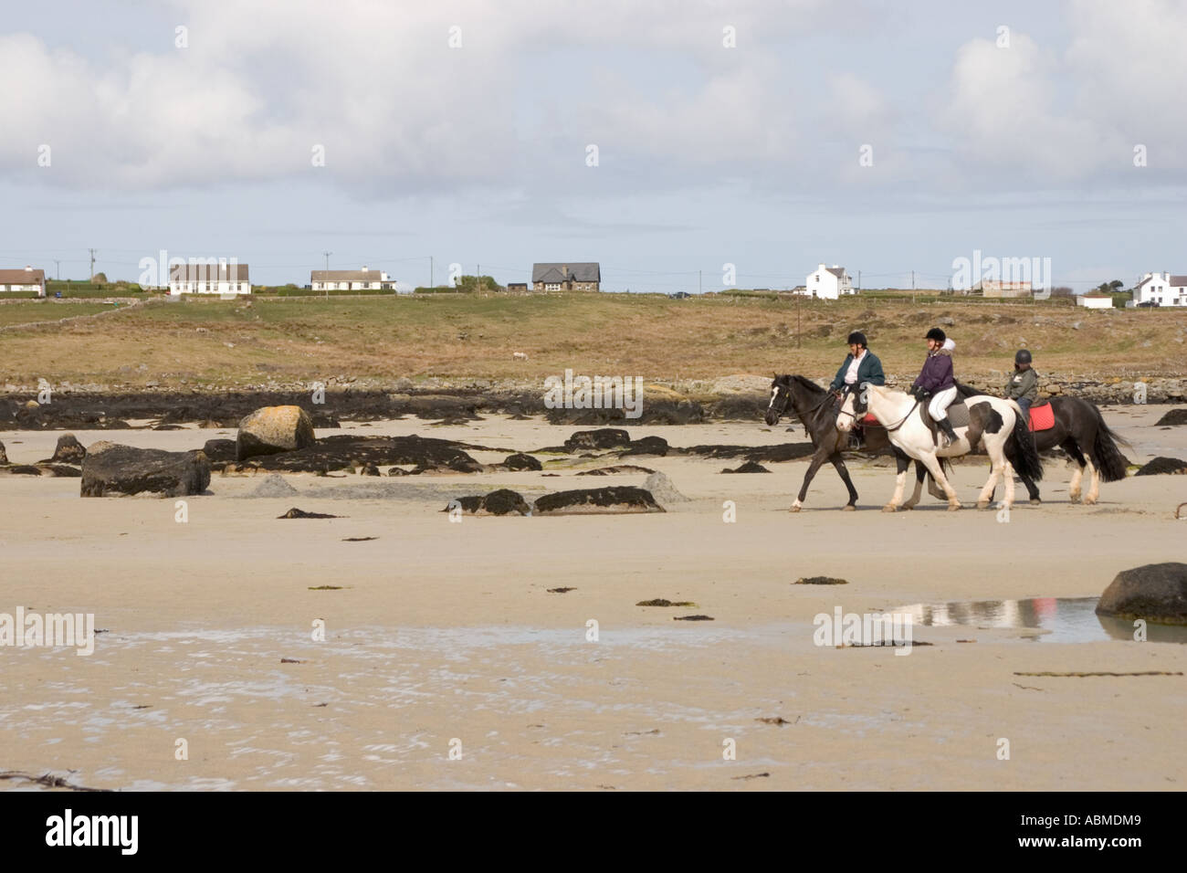 Horse riders on Omey strand Connemara Ireland Stock Photo - Alamy
