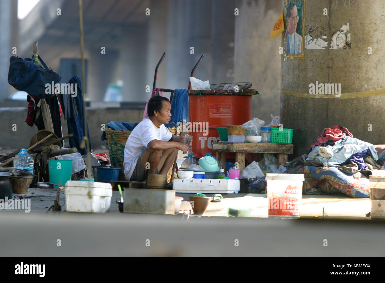 Man living under bridge in Bangkok, Thailand Stock Photo - Alamy