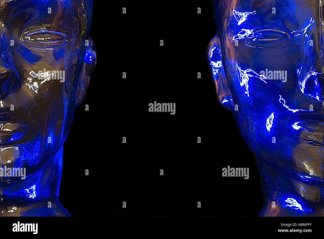 Two futuristic heads stare straight ahead Stock Photo - Alamy