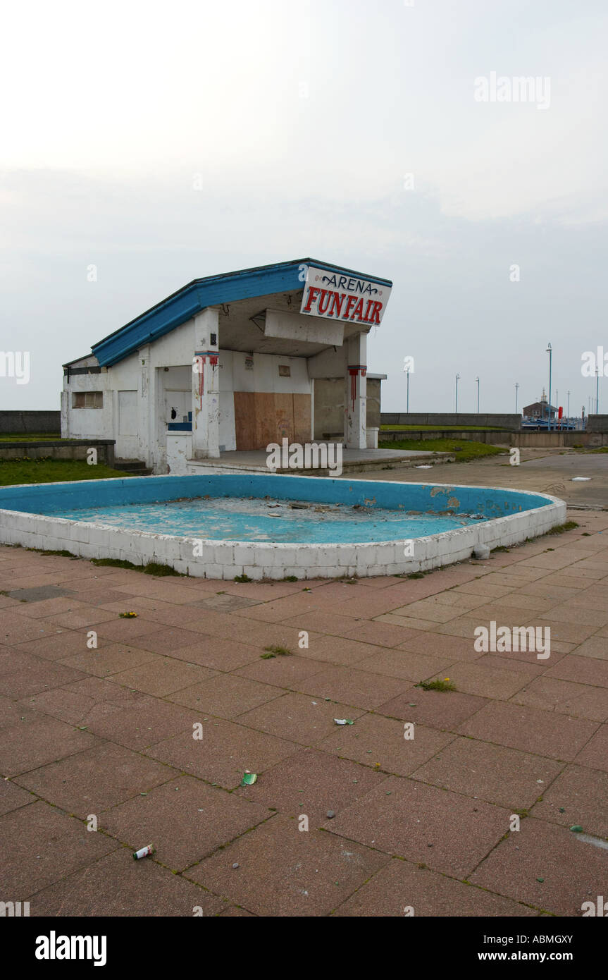 vertical portrait photo of a derelict rundown fun fair building at the ...