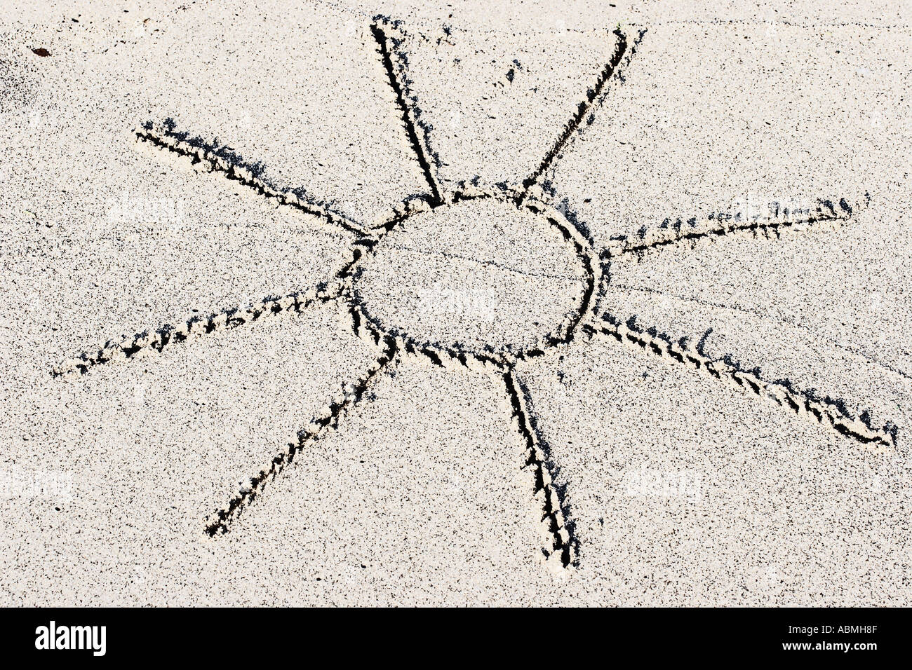 Sun Symbol Drawn Into Sand Stock Photo - Alamy