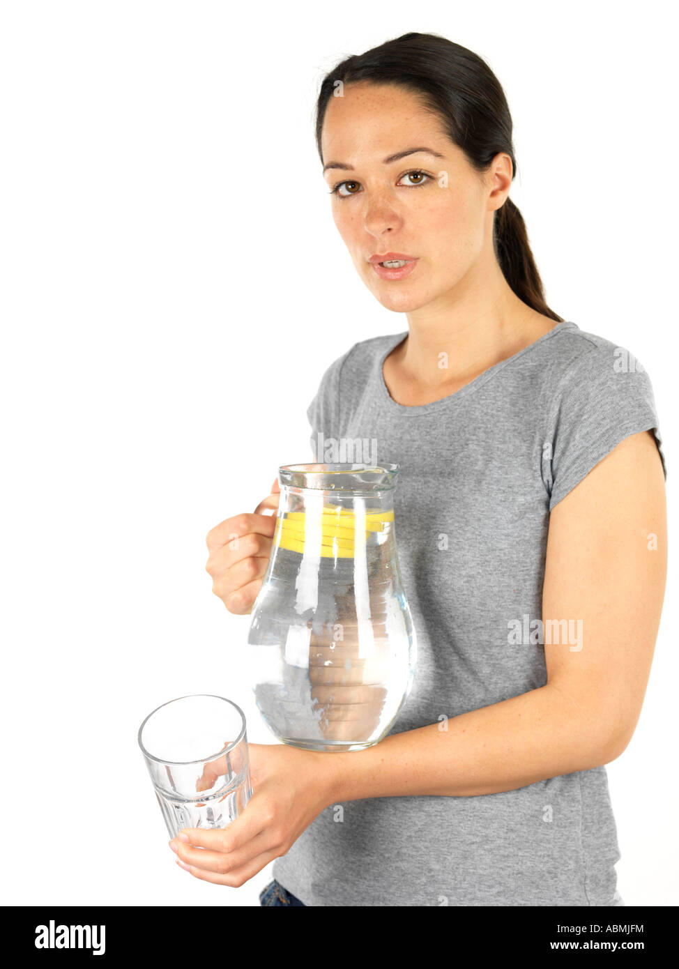 Young Woman Pouring Glass of Water Model Released Stock Photo - Alamy