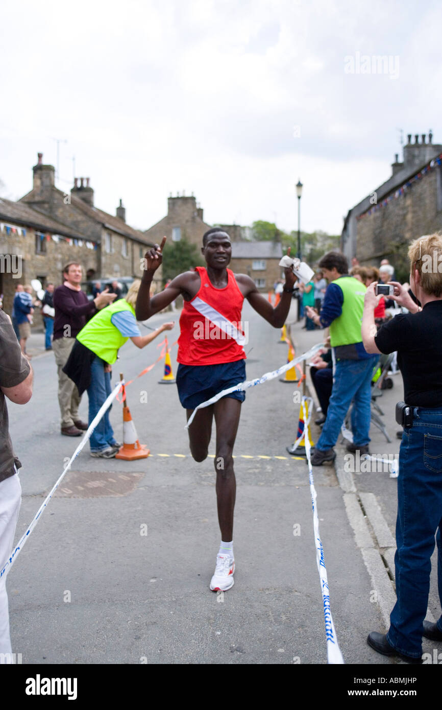 a runner completes a road race in Lancashire Stock Photo - Alamy