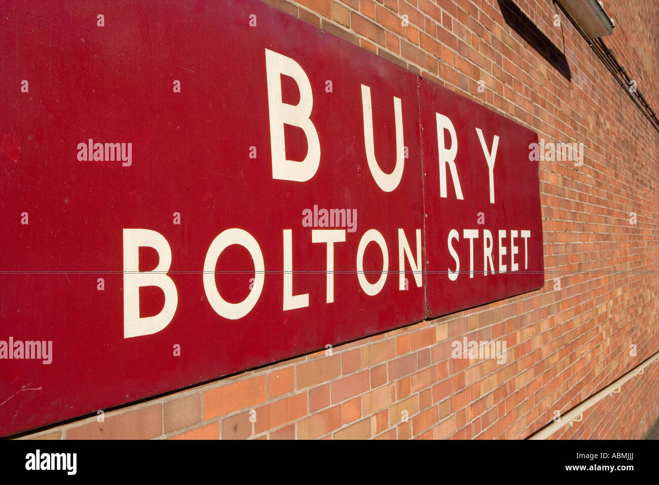 sign bury bolton street on the wall of a railway station Stock Photo ...