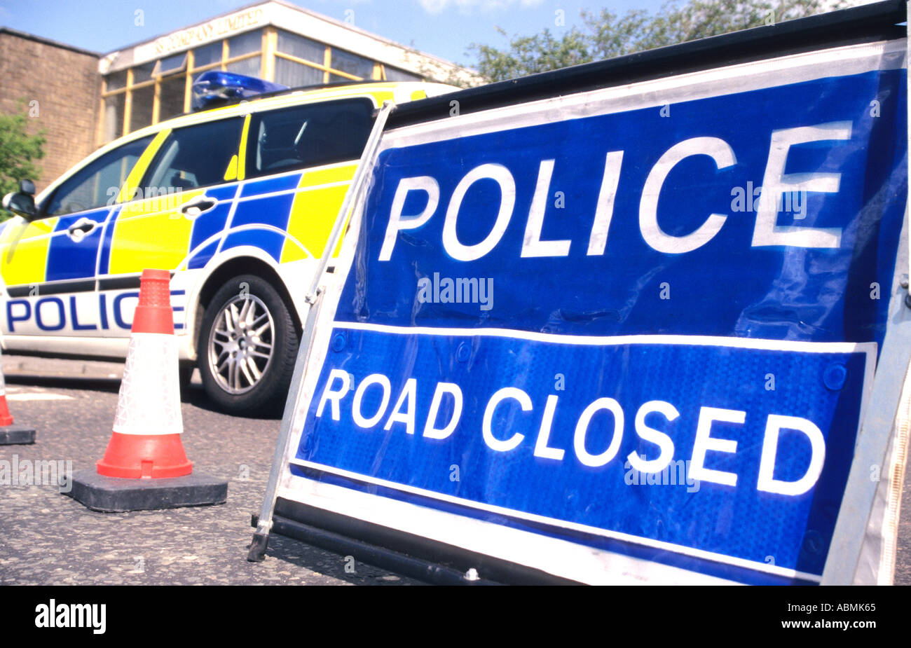 A police road closed sign and car Stock Photo - Alamy