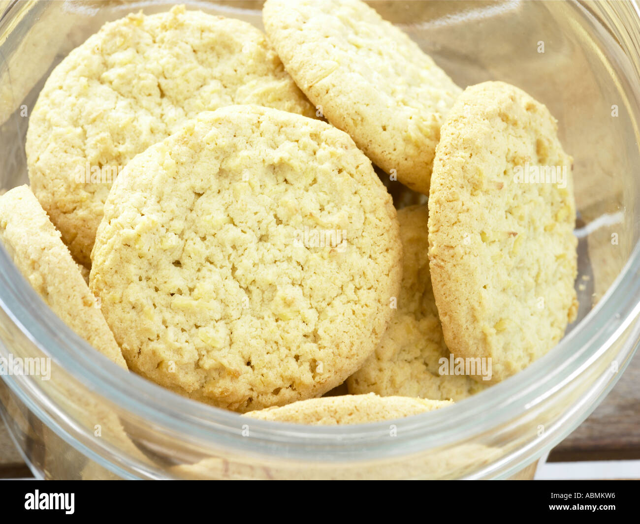 cookies in a glass cookie jar on table from above with the lid taken ...