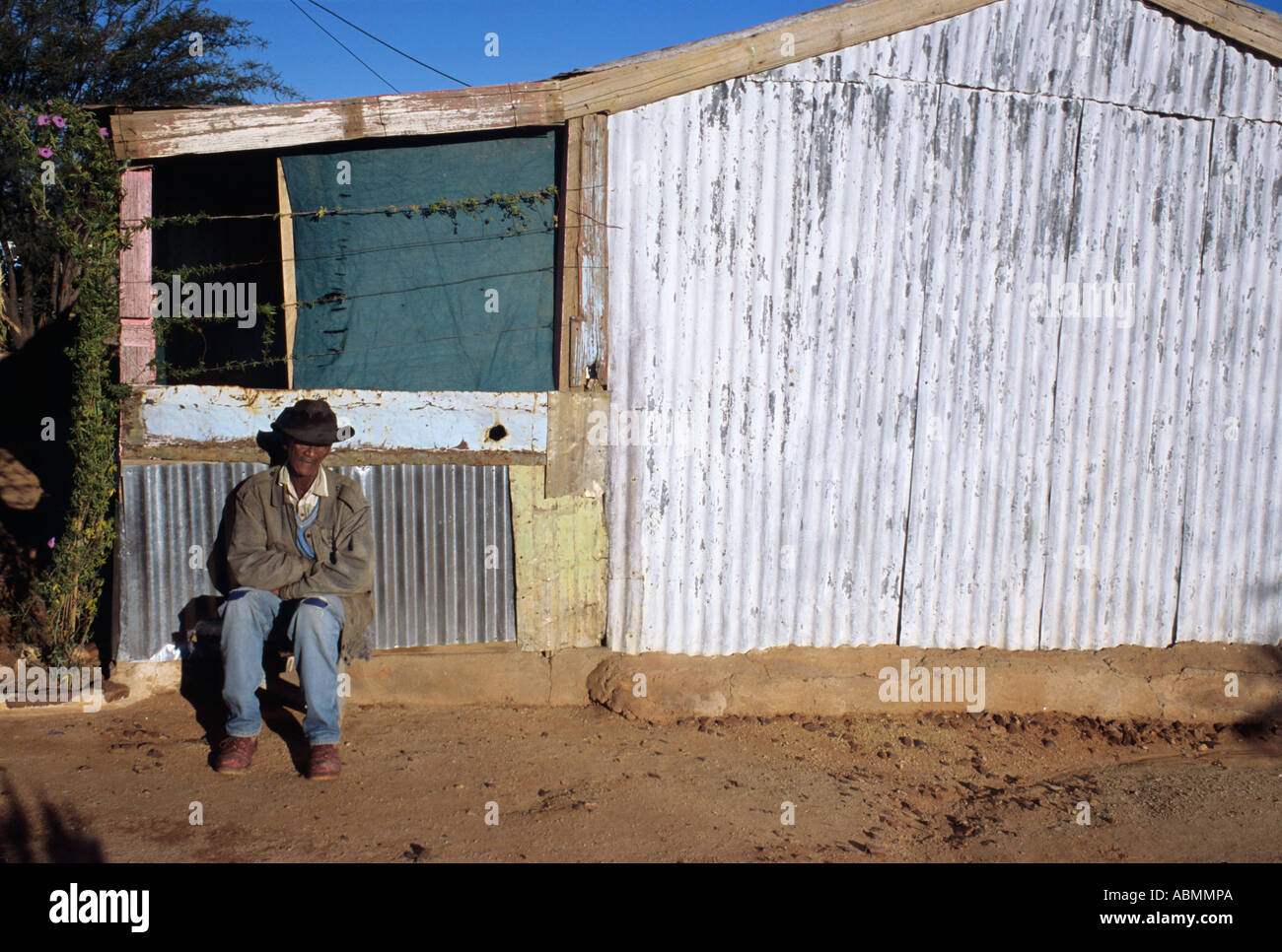 Man sitting outside his house, South Africa Stock Photo - Alamy