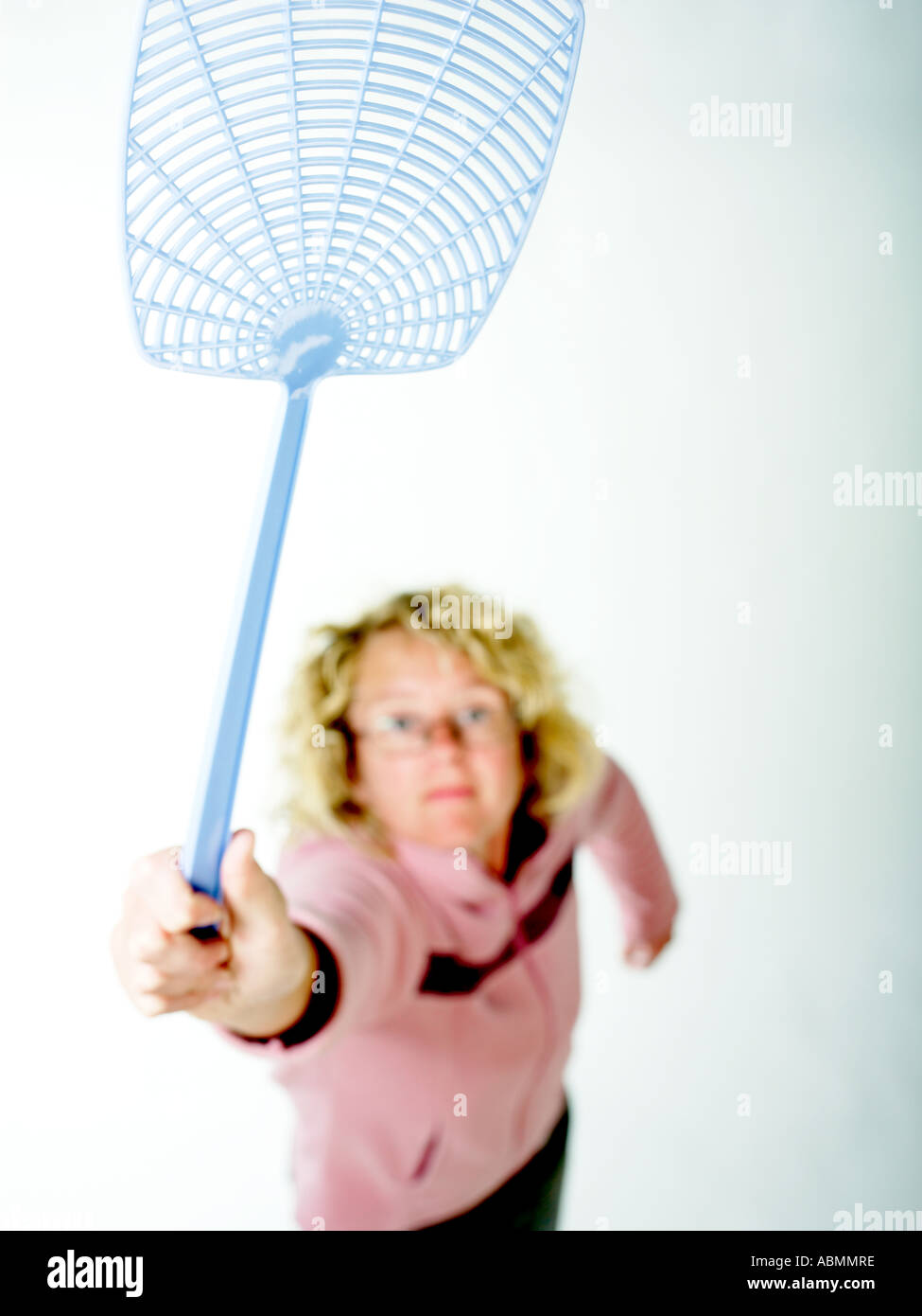 Woman with fly swat hi-res stock photography and images - Alamy