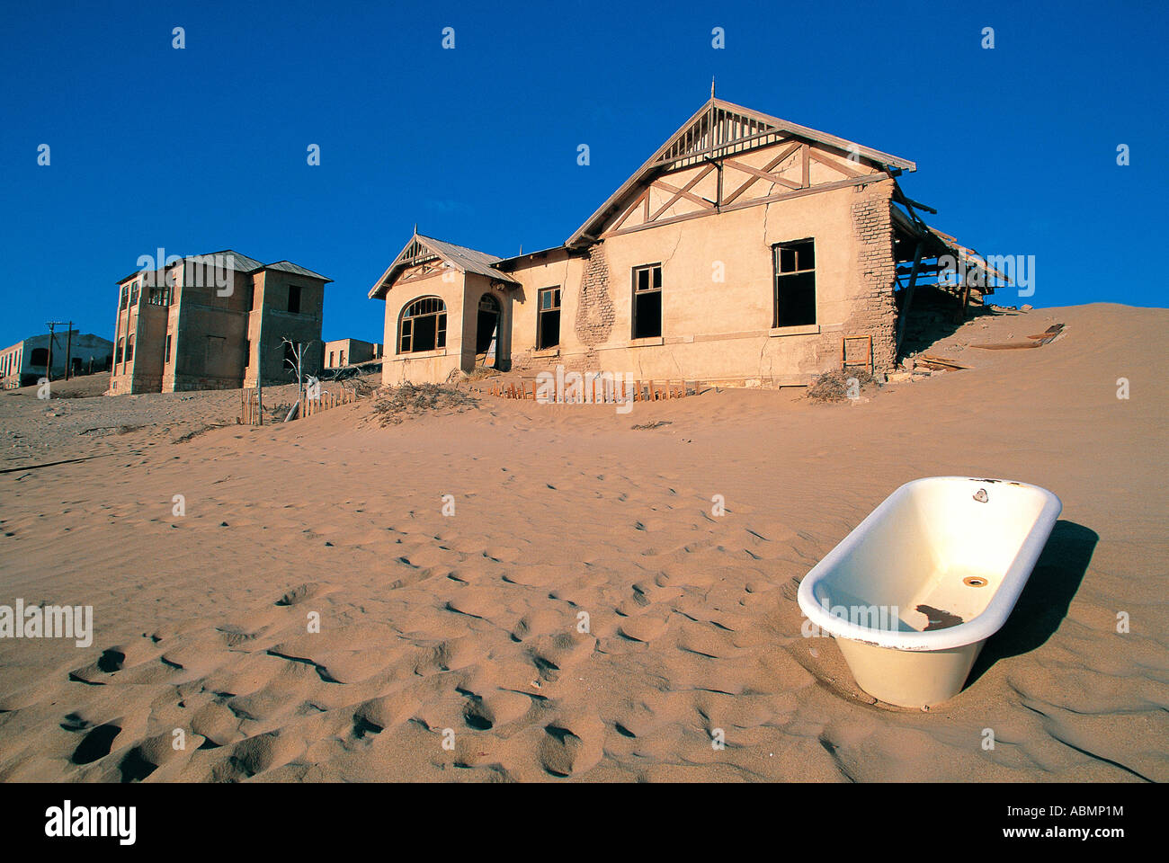 Abandoned houses in the Ghost town of Kolmanskop near Luderitz Namibia ...