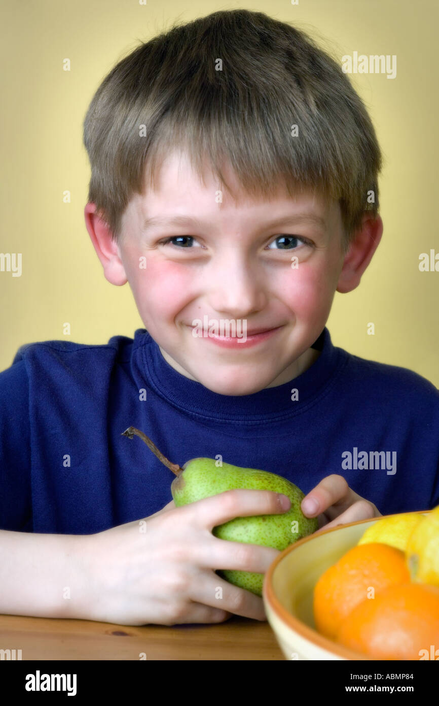 Boy eating a pear hi-res stock photography and images - Alamy
