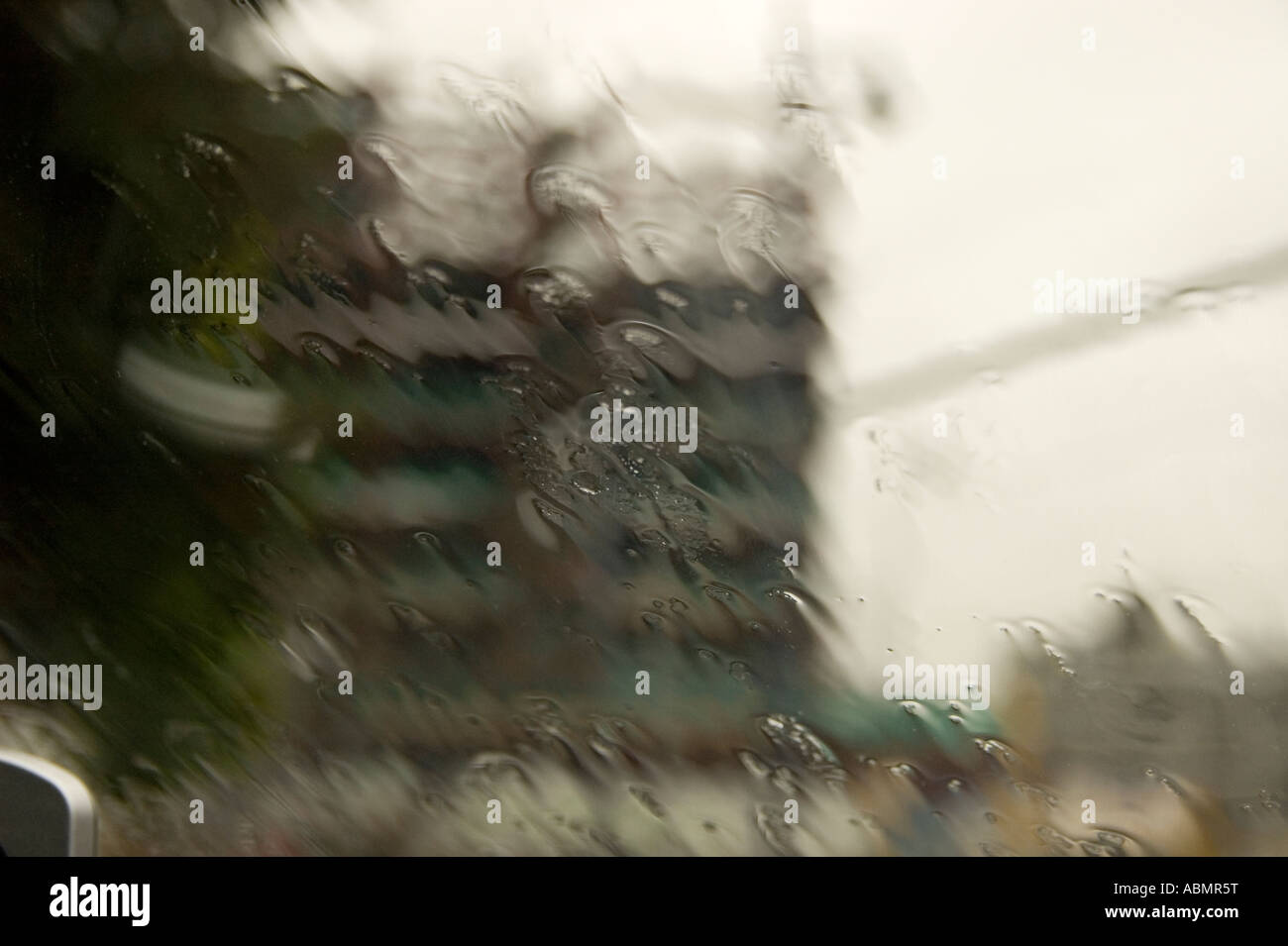 heavy rainfall on a window in an urban area Stock Photo - Alamy