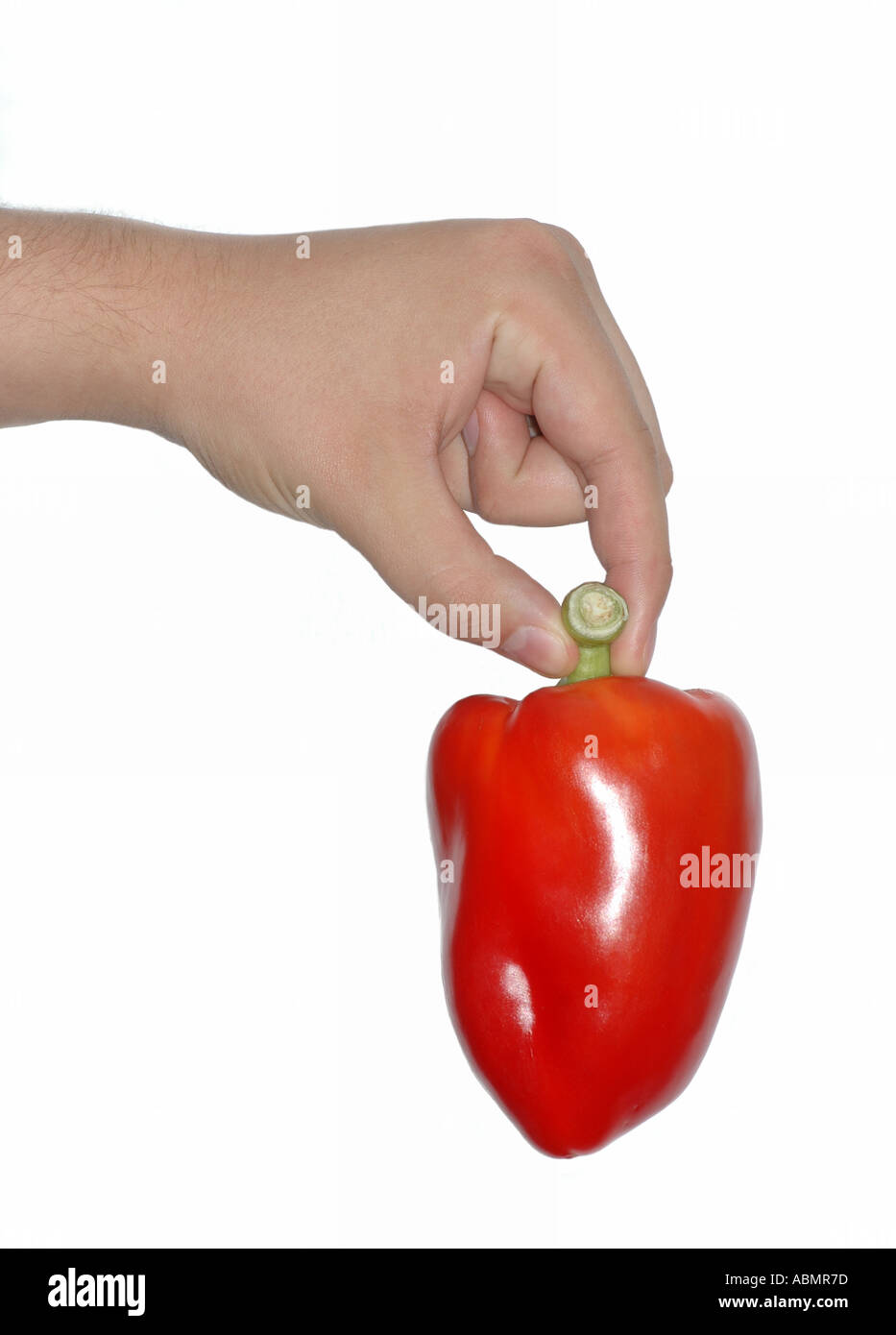Hand holding capsicum Cut Out Stock Images & Pictures - Alamy