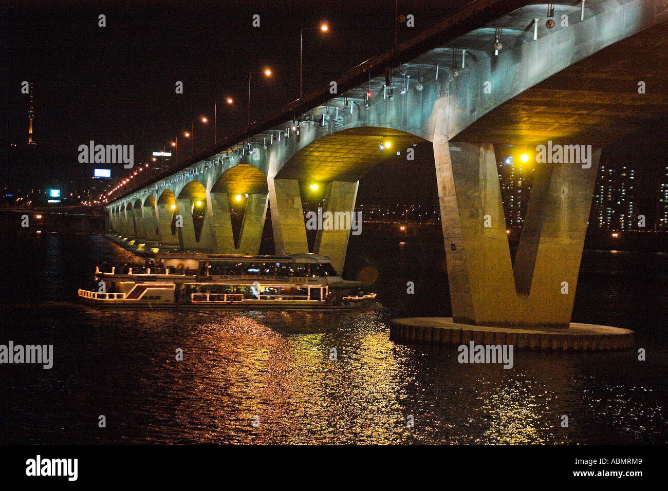 Ferry floats under bridge over Han river Seoul South Korea Stock Photo ...