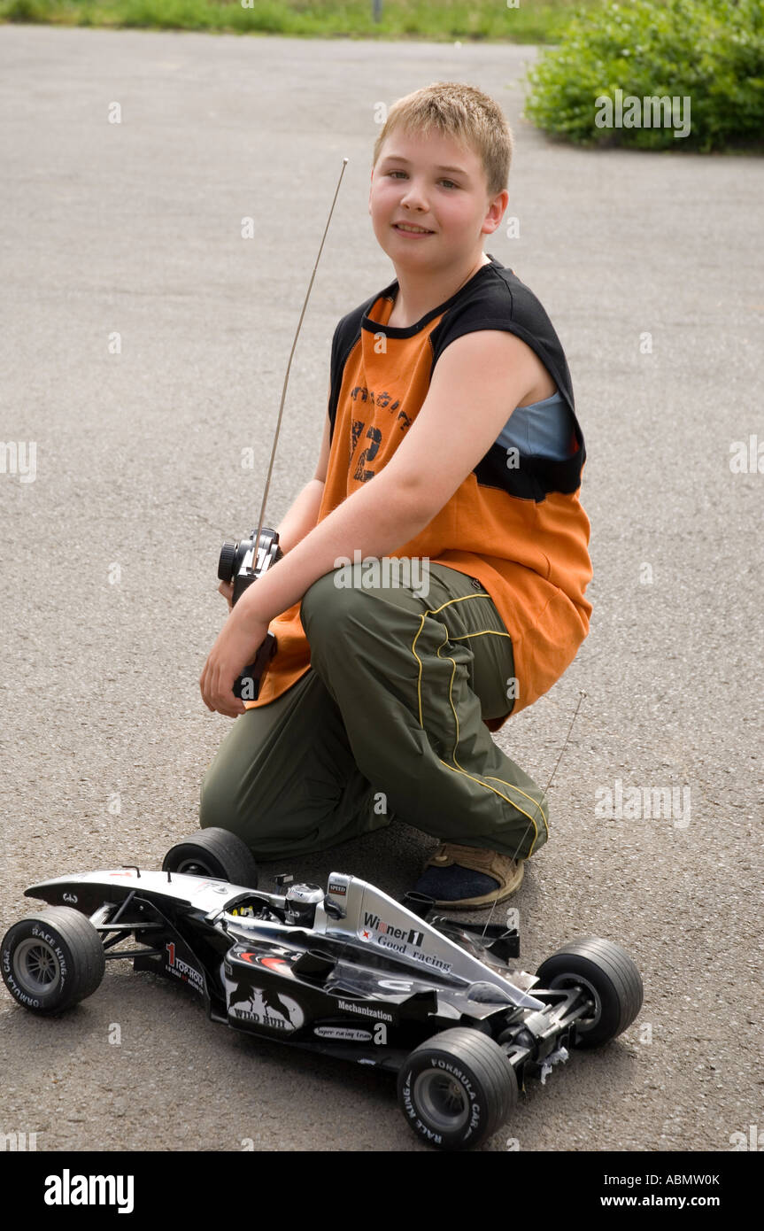 Boy with remote control race car Stock Photo - Alamy