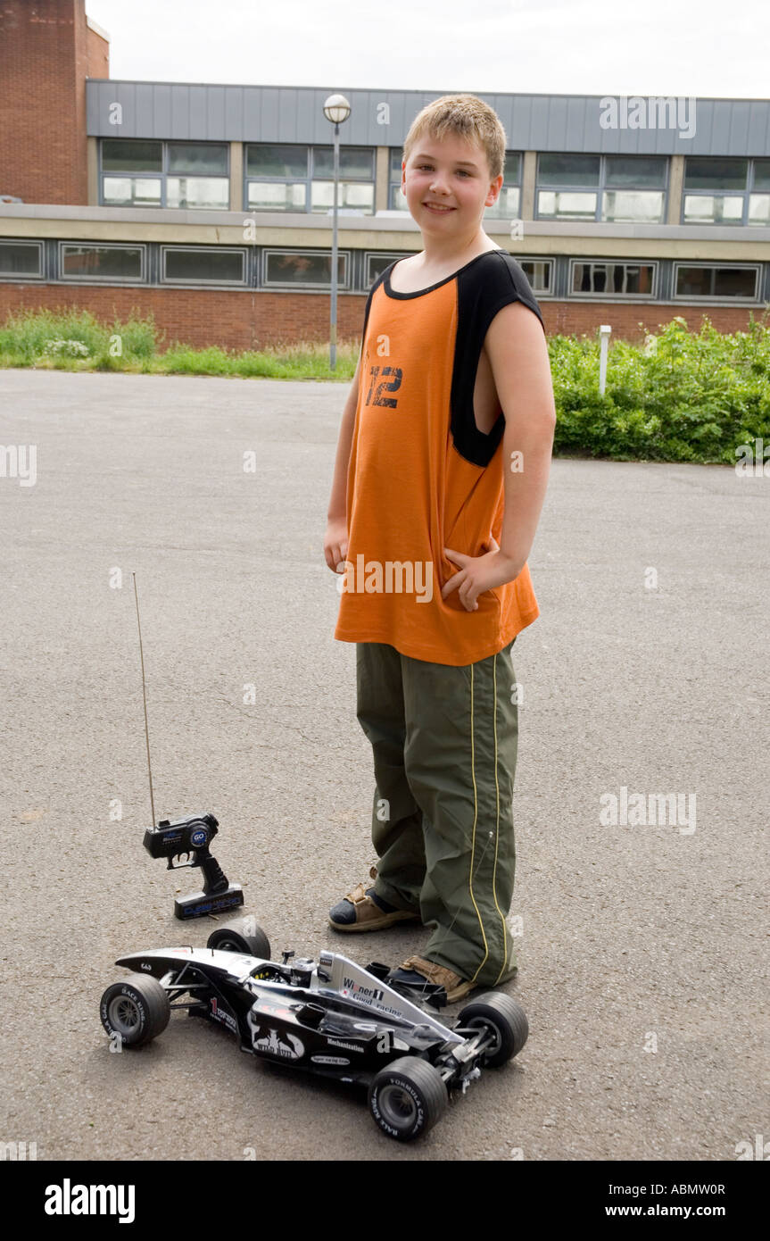 Boy with remote control race car Stock Photo - Alamy