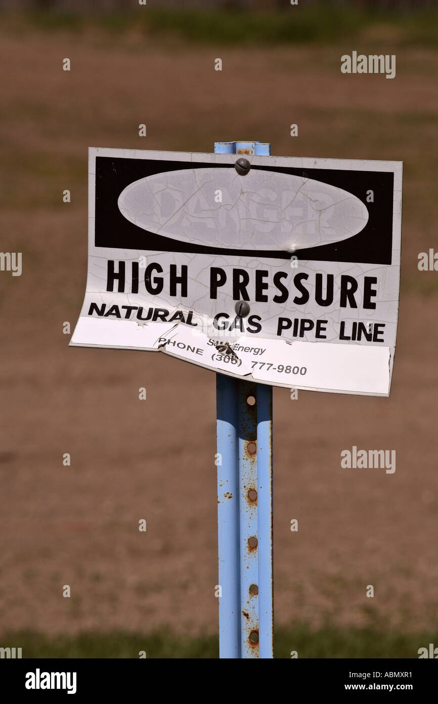 Slightly bend sign for underground pipes in scenic Saskatchewan Canada ...
