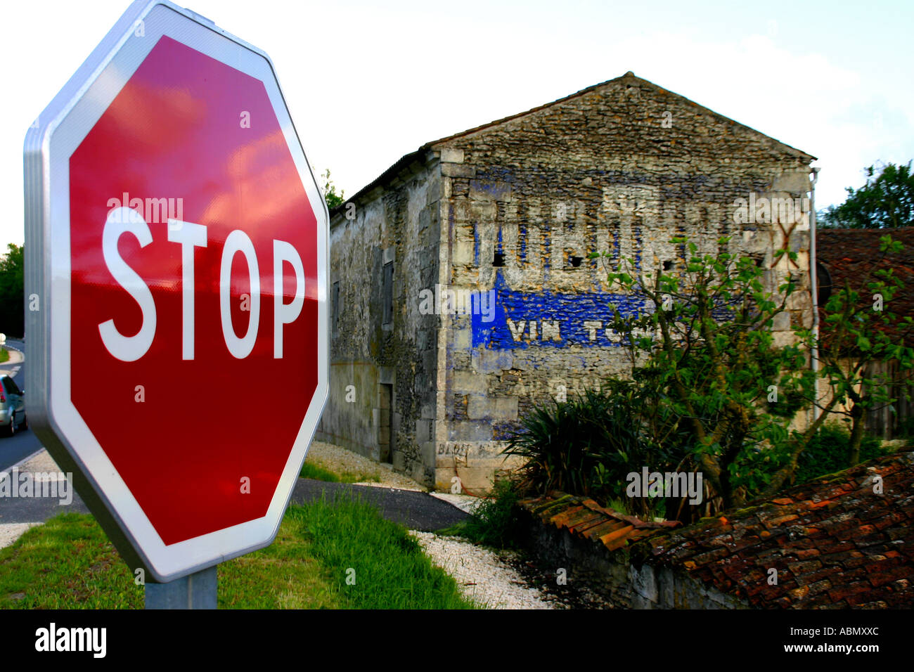 A barn with an old advertising sign in the Charente region of Western ...