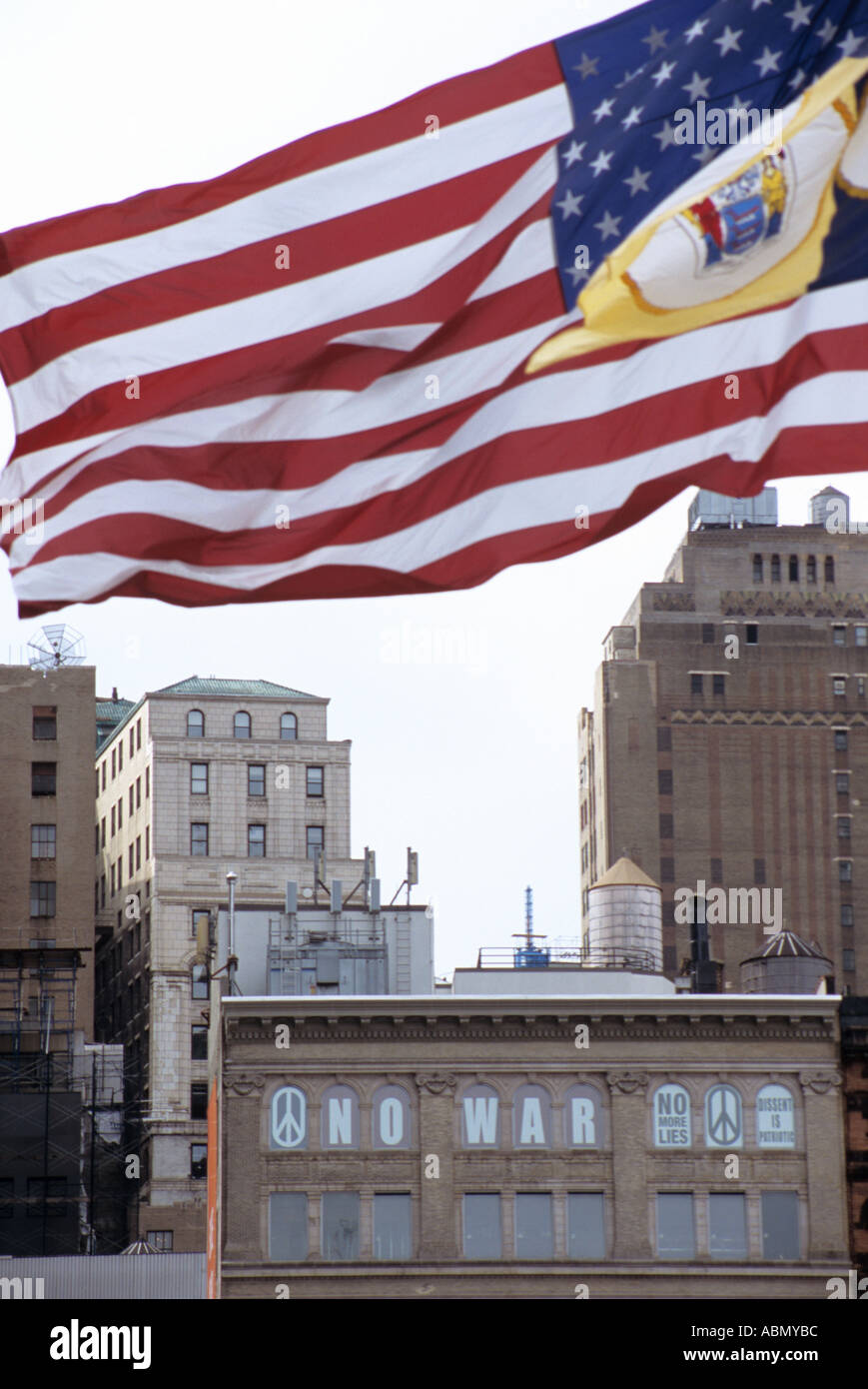 American flag flies over Ground Zero with protest banners in the ...