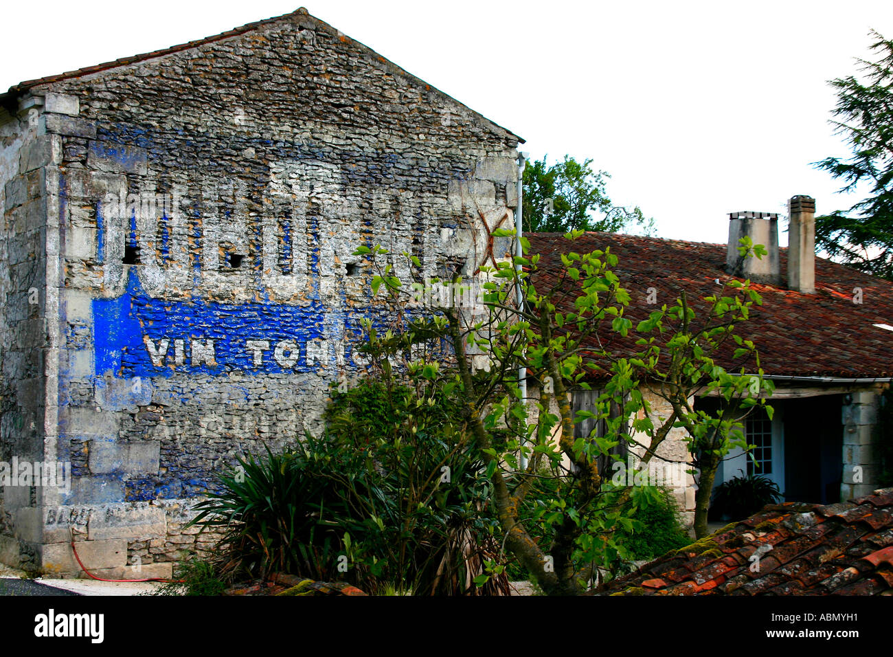 A barn with an old advertising sign in the Charente region of Western ...