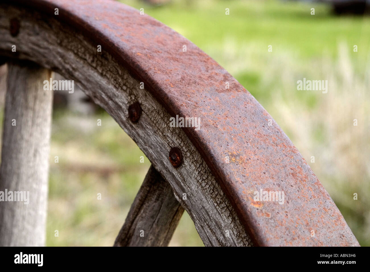 Aged wood and rusted rim of an antique wagon wheel in the Sukanen ...