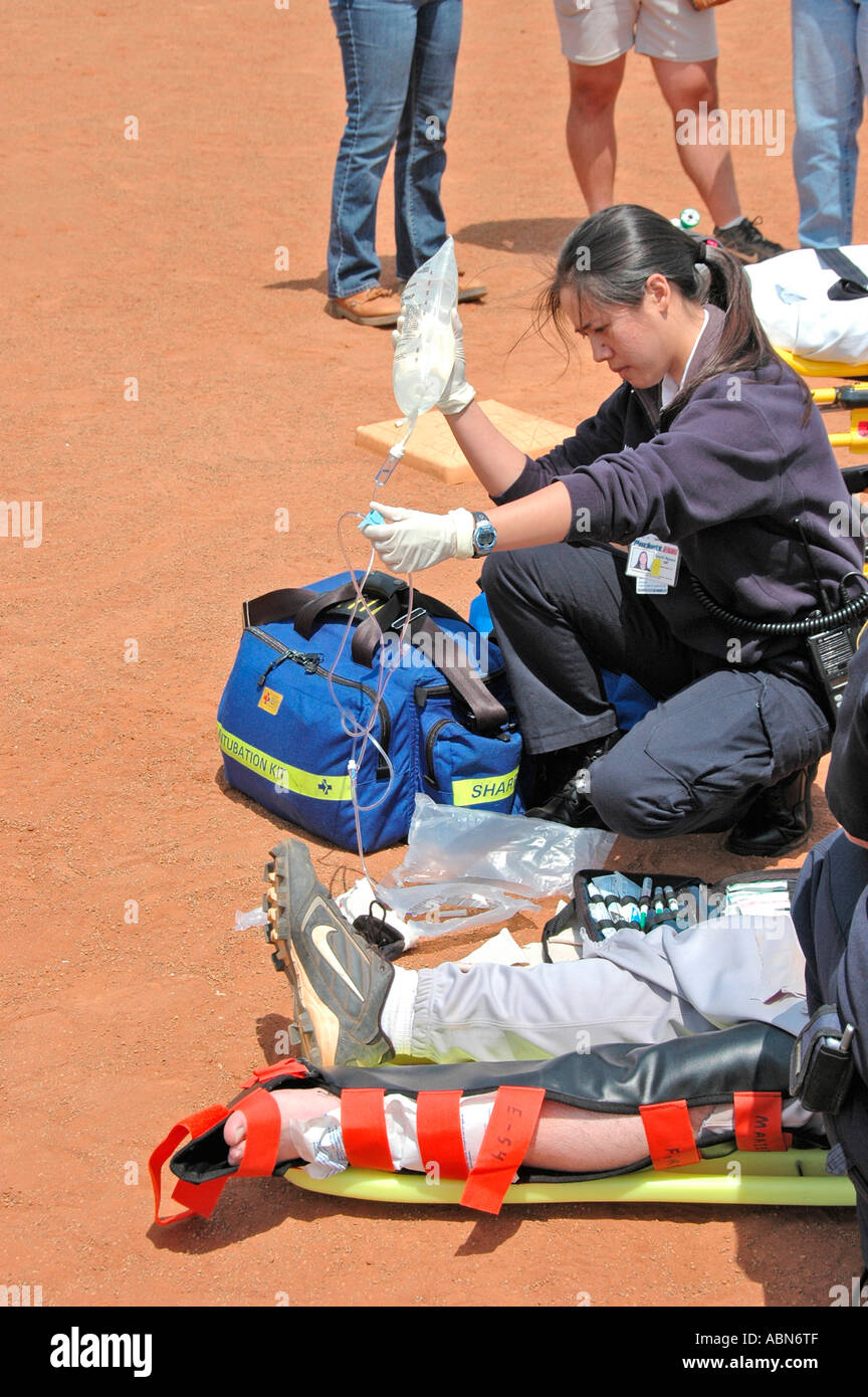 Player with broken leg ankle is attended to by fire personal and wife ...