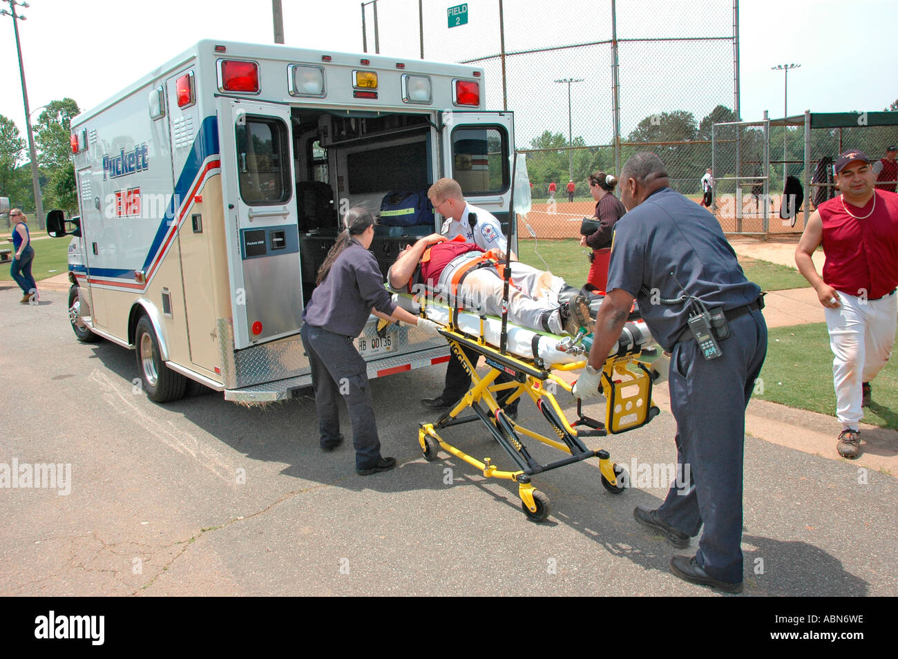 Player with broken leg ankle is attended to by fire personal and wife ...
