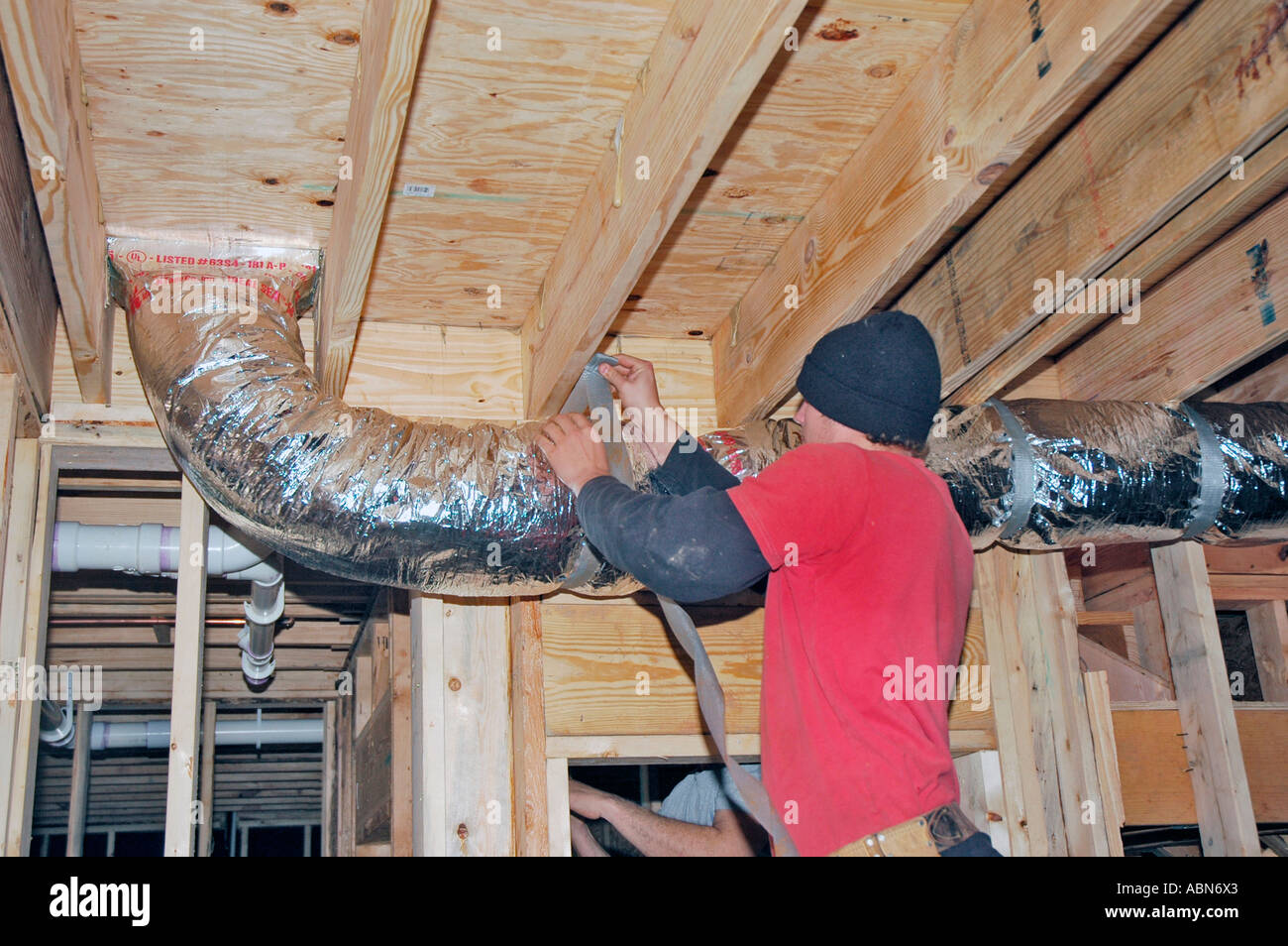 Air Conditioning being installed in new home construction for heating ...