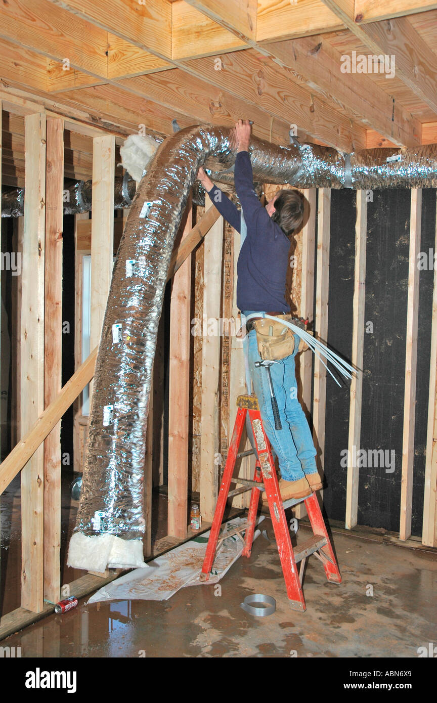 Air Conditioning being installed in new home construction for heating ...