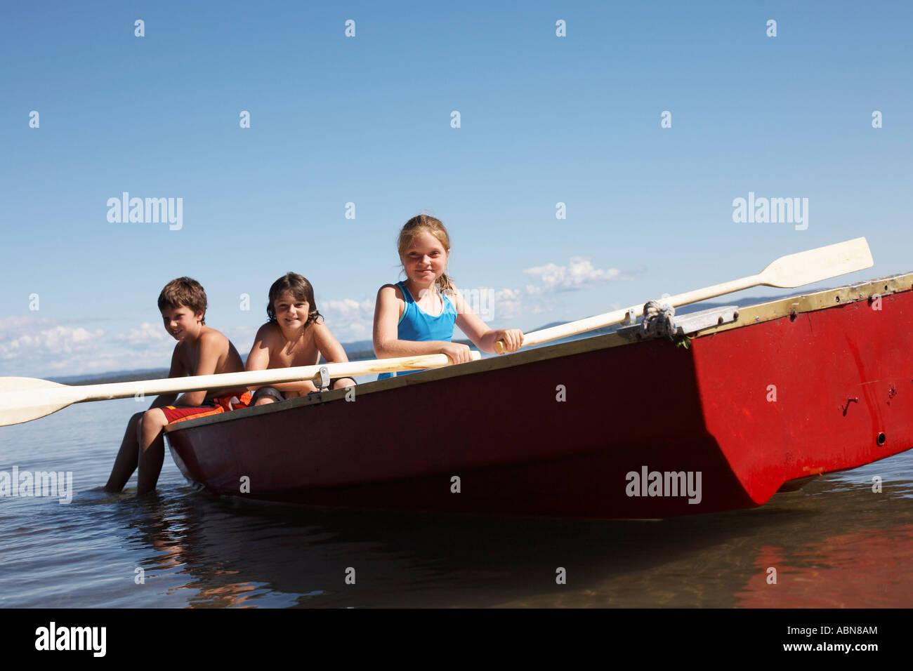 Children in Rowboat Stock Photo - Alamy