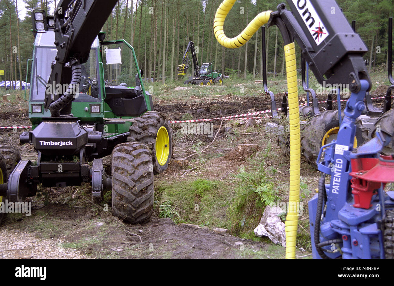 Forestry harvestor tractors cutting trees Stock Photo - Alamy