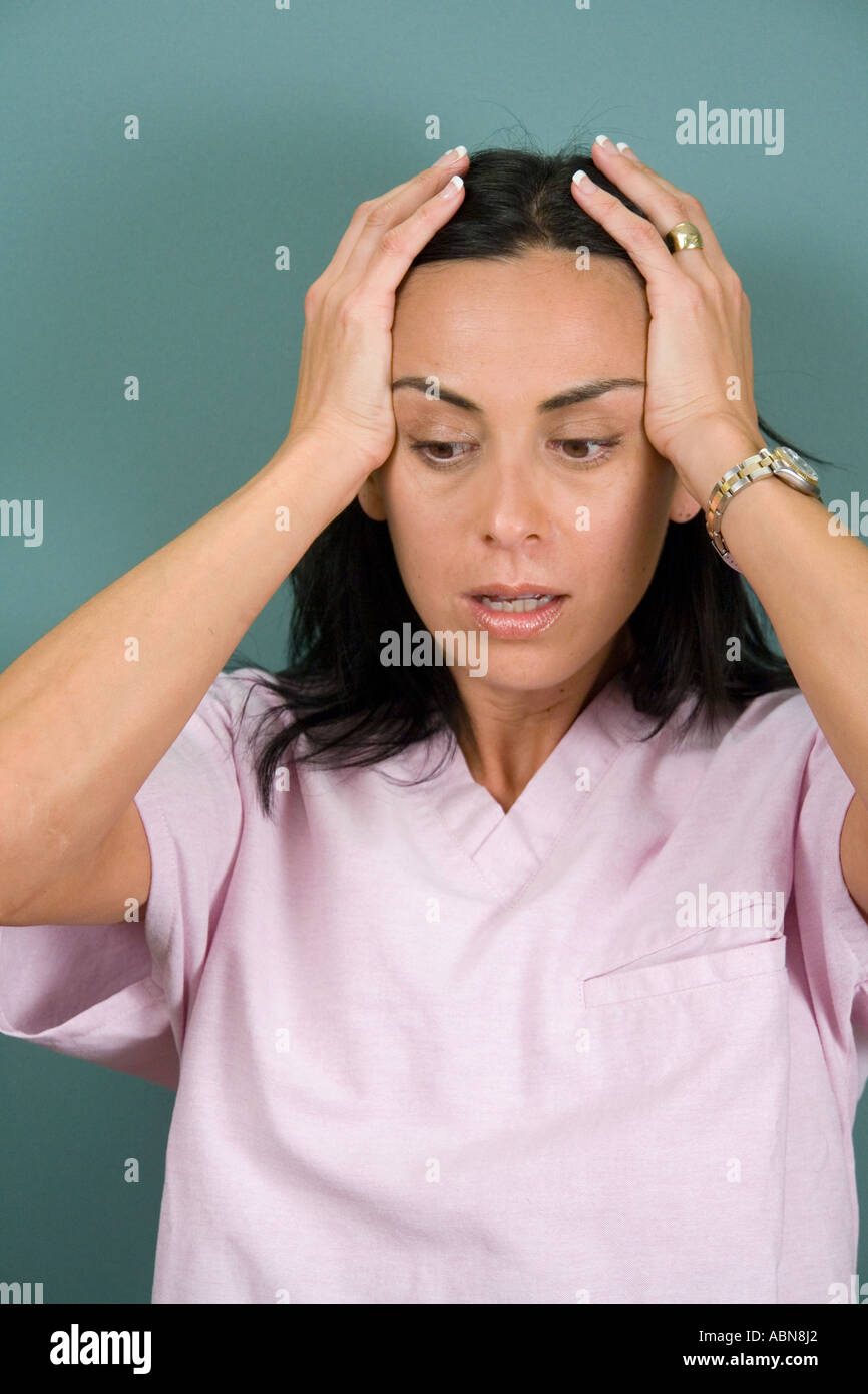 Portrait of young adult nurse scared Stock Photo - Alamy