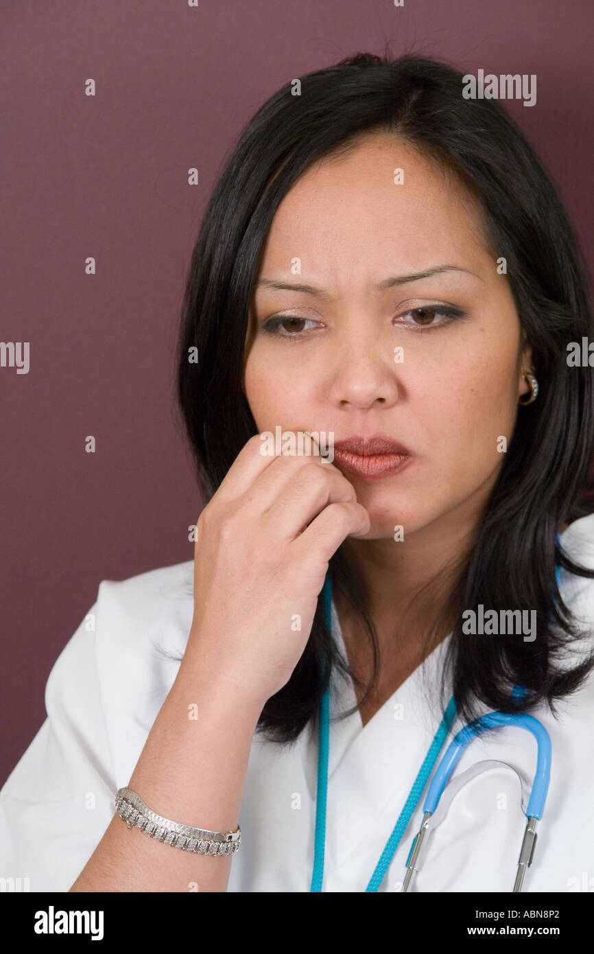 Portrait of adult nurse thinking Stock Photo - Alamy