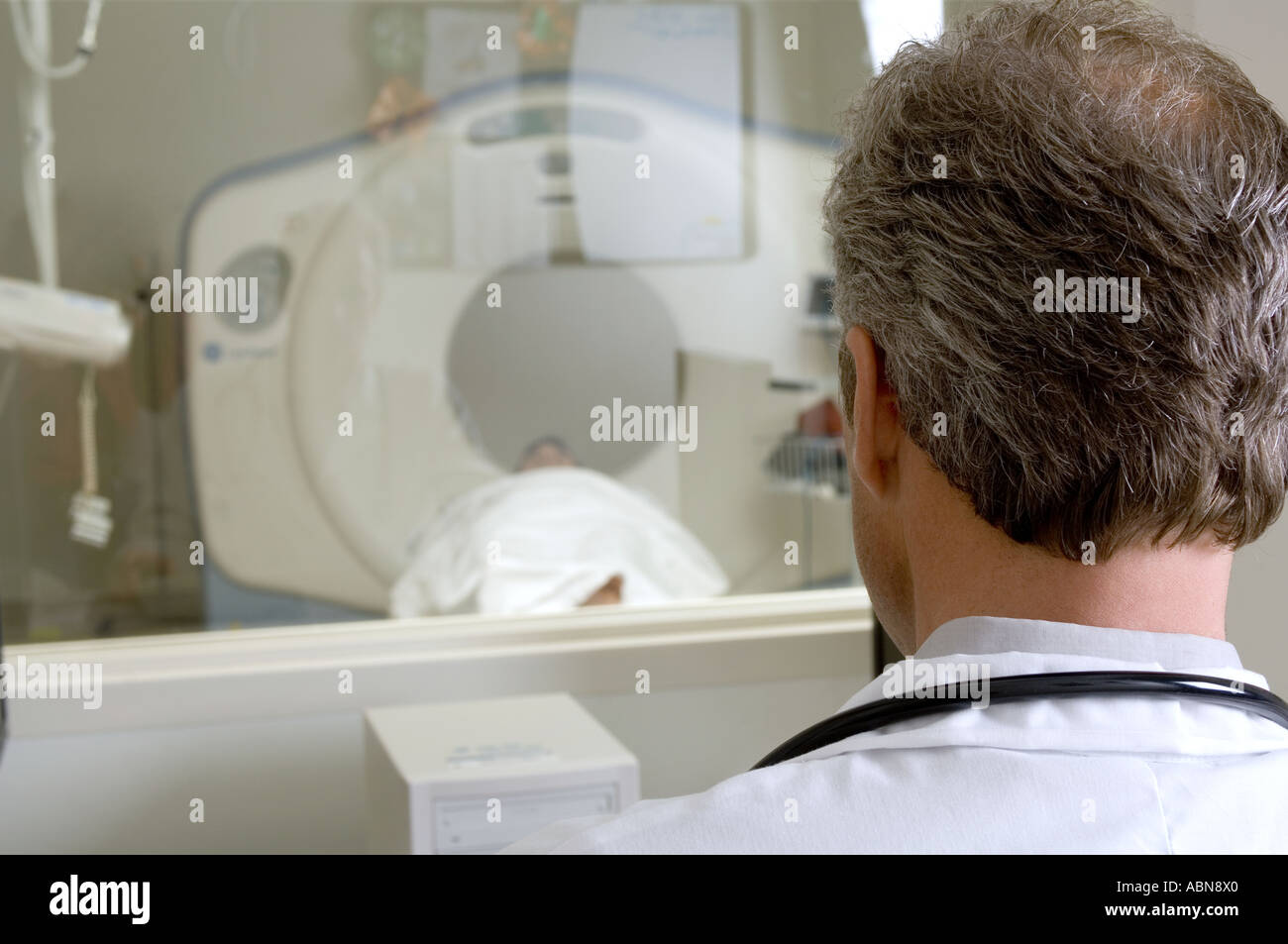 Portrait of doctor looking after cat scan patient Stock Photo - Alamy