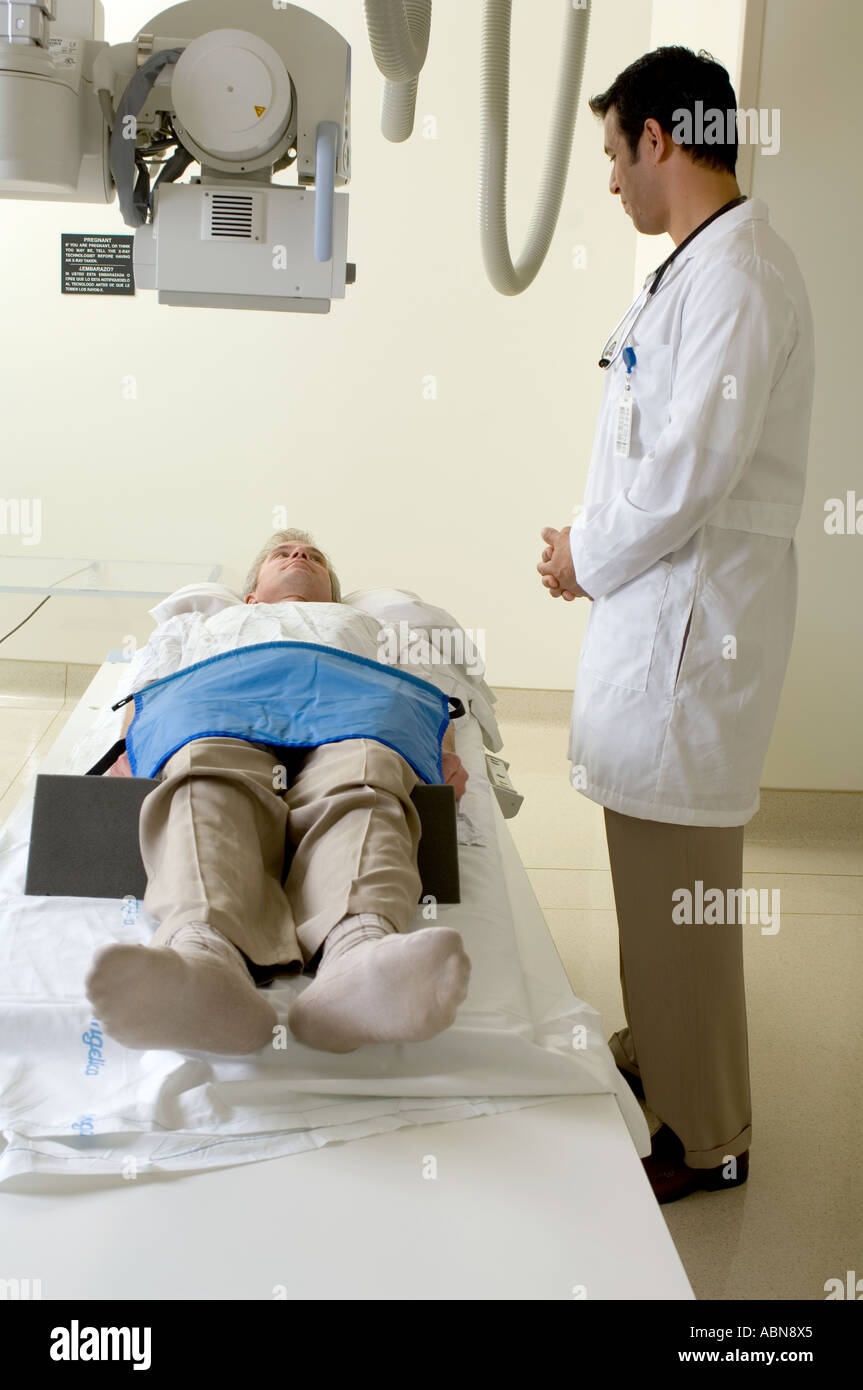 Portrait of doctor treating older patient Stock Photo - Alamy