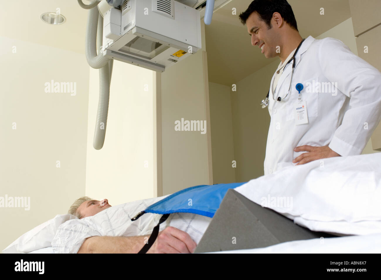 Portrait of doctor treating older patient Stock Photo - Alamy
