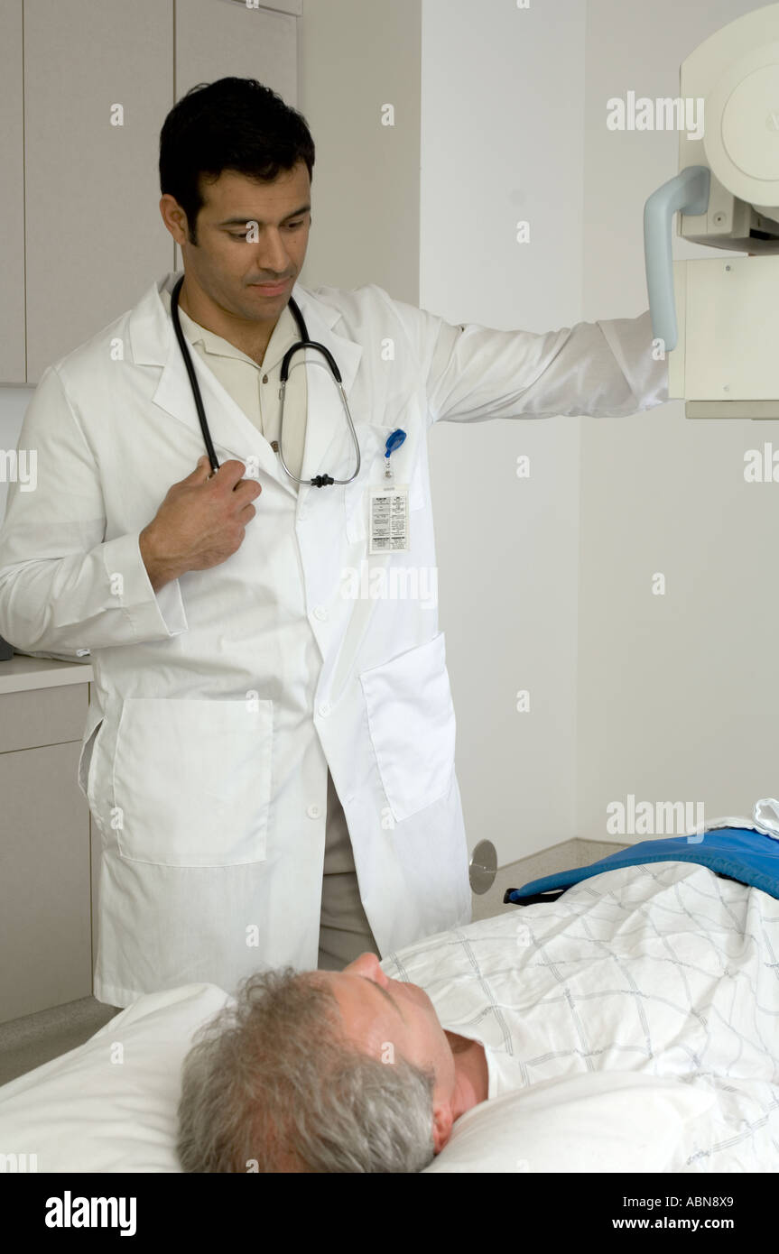 Portrait of doctor treating older patient Stock Photo - Alamy
