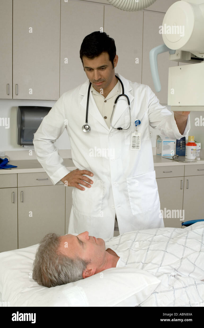 Portrait of doctor treating older patient Stock Photo - Alamy