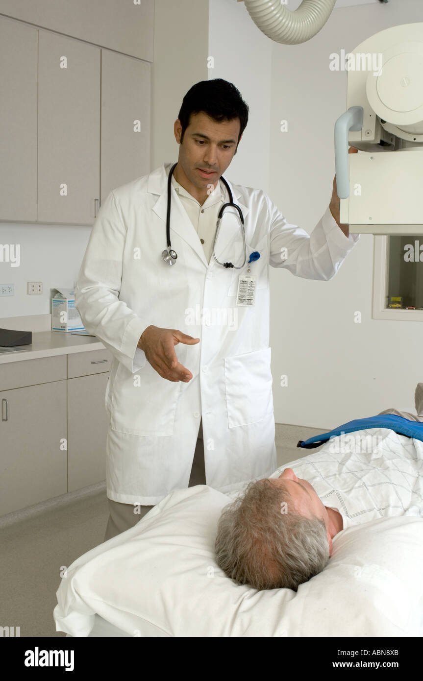 Portrait of doctor treating older patient Stock Photo - Alamy