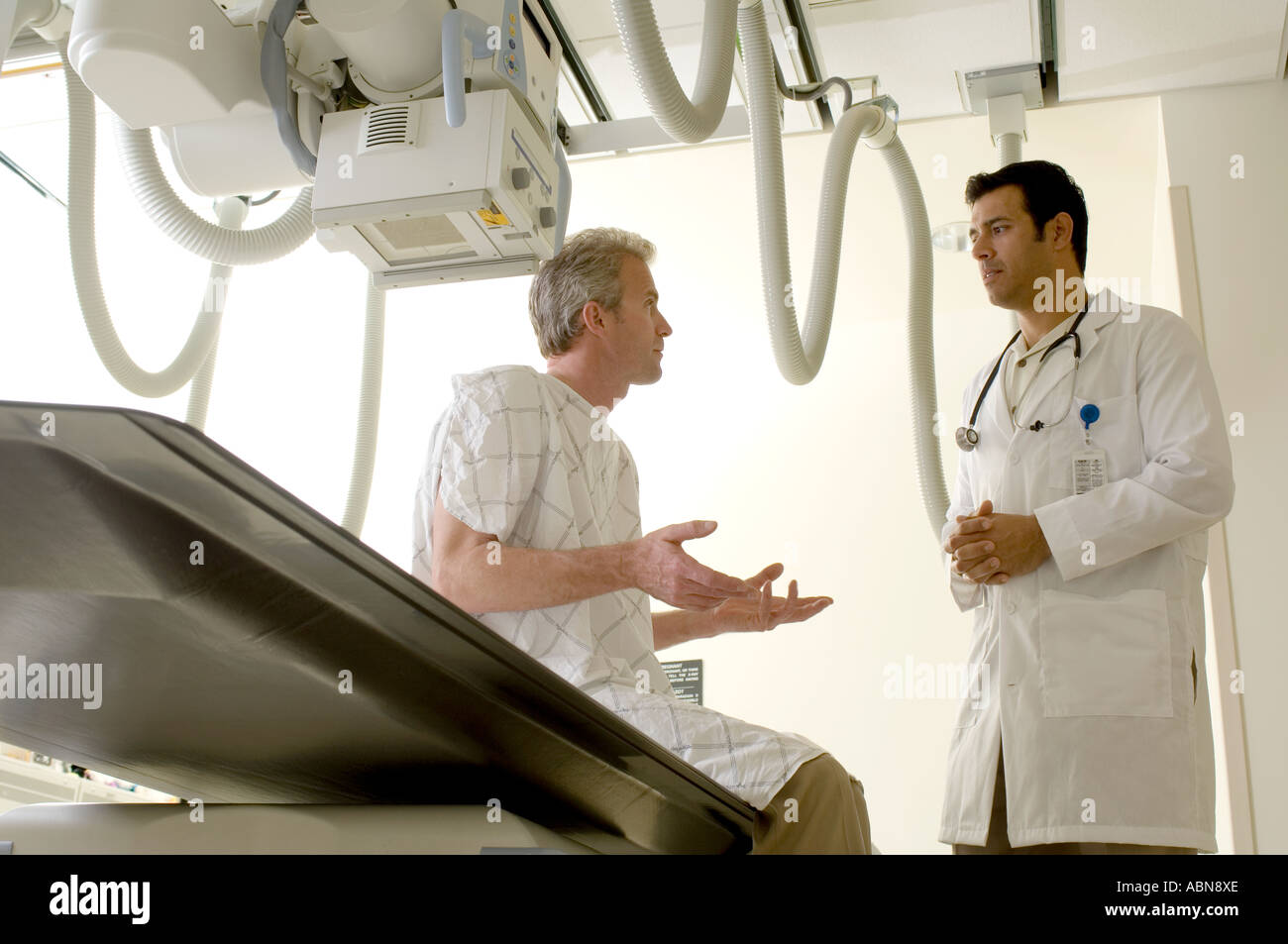 Portrait of doctor treating older patient Stock Photo - Alamy