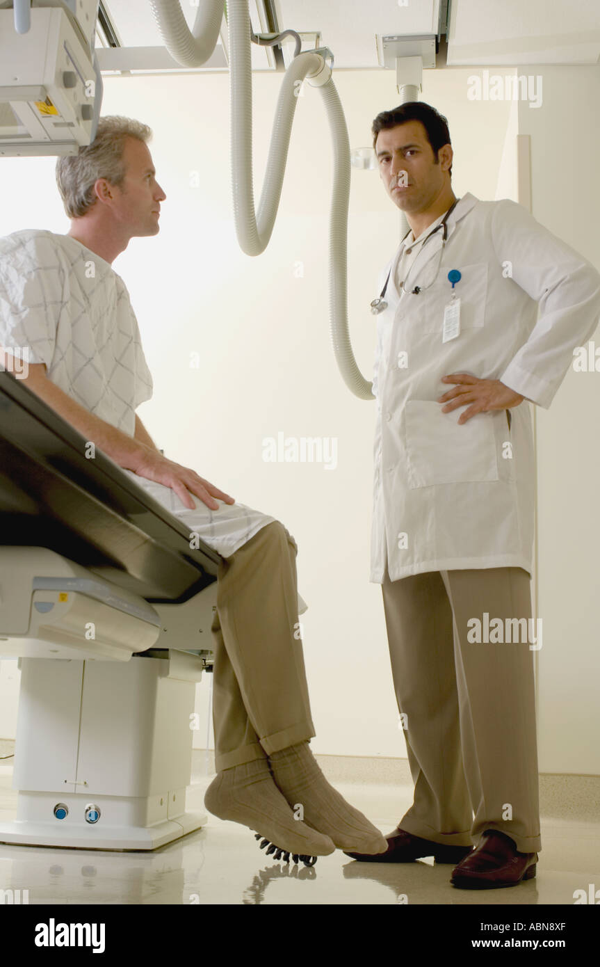 Portrait of doctor treating older patient Stock Photo - Alamy