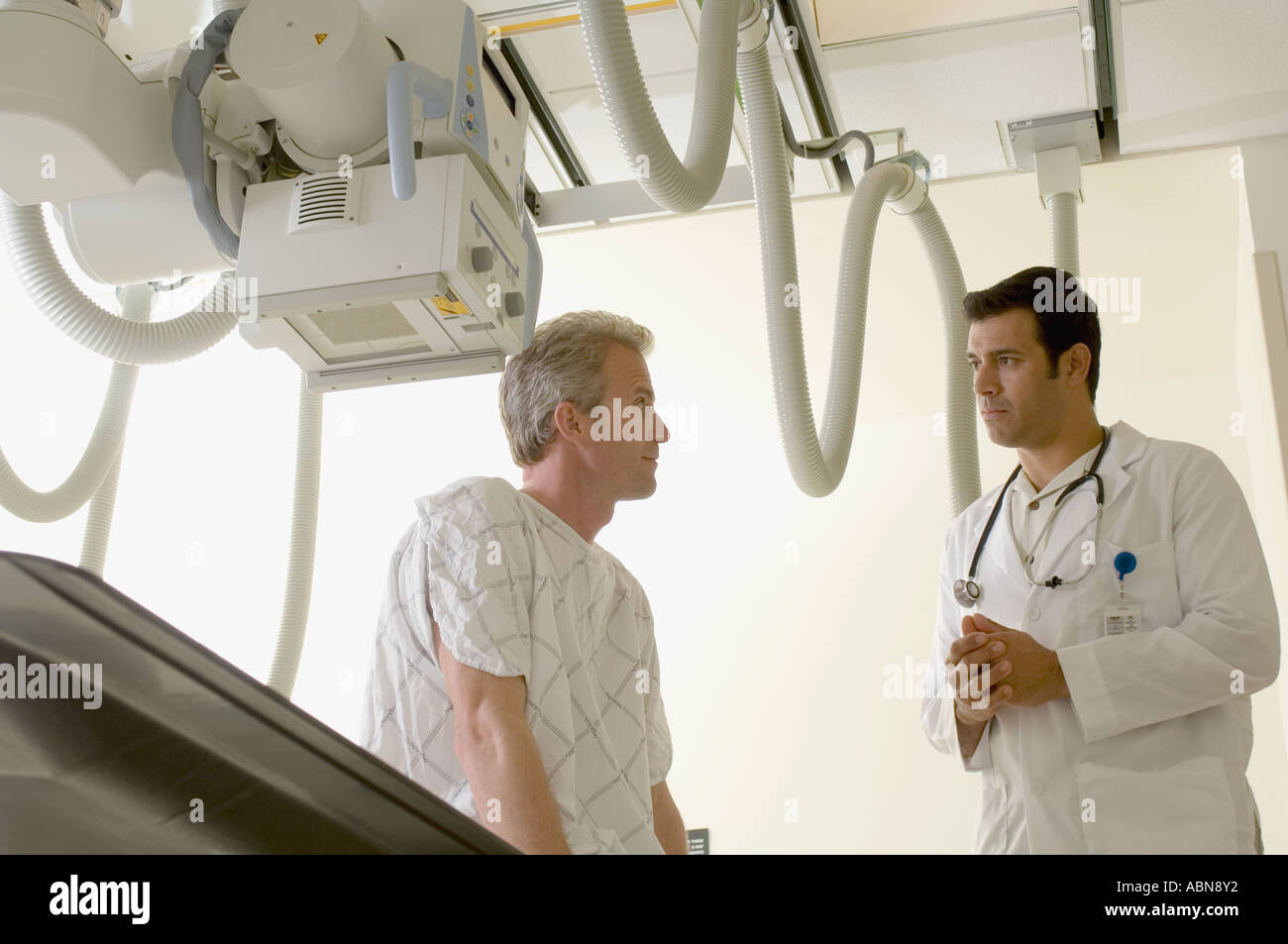 Portrait of doctor treating older patient Stock Photo - Alamy