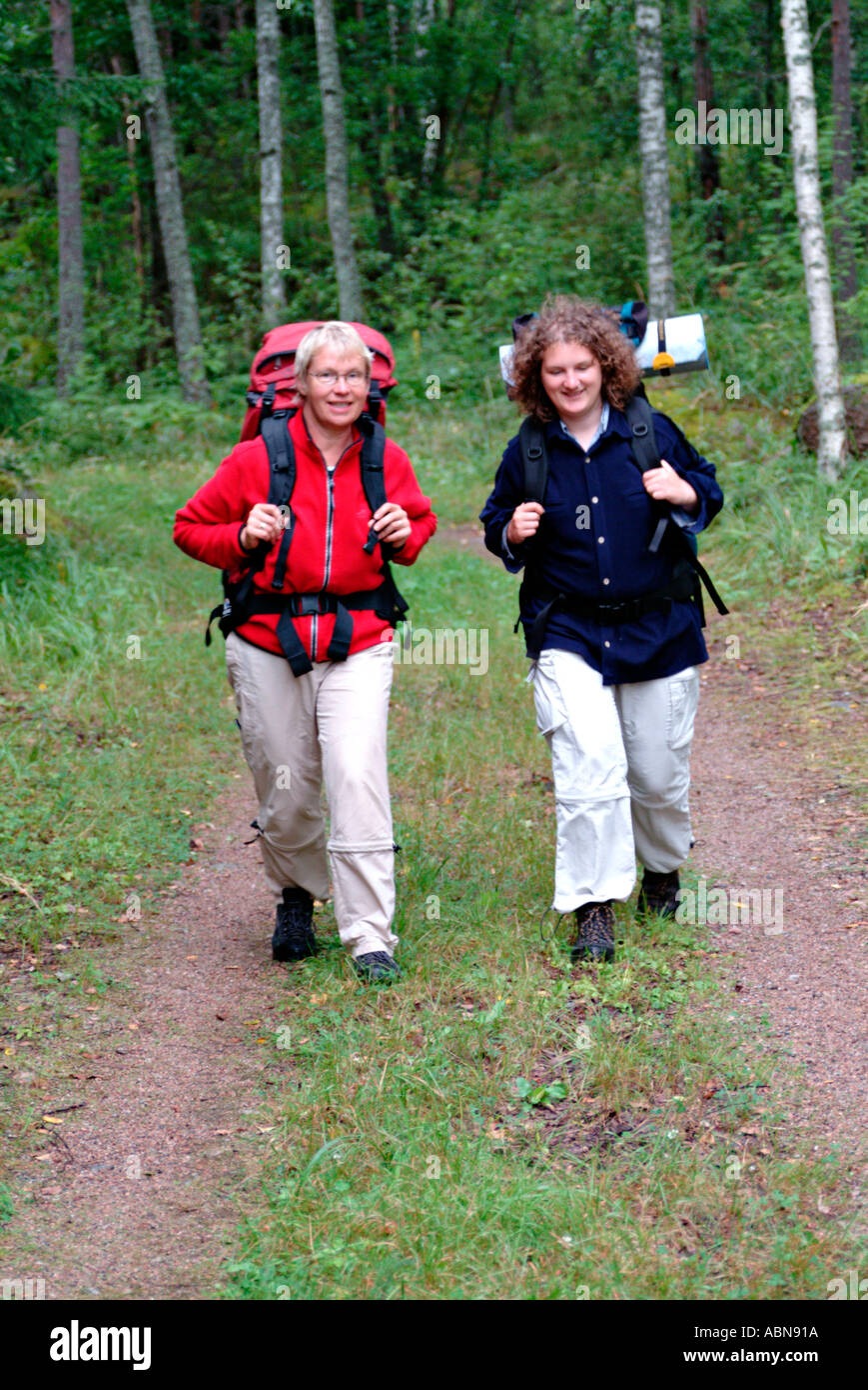 two women hiking togethter in forest MR Stock Photo - Alamy