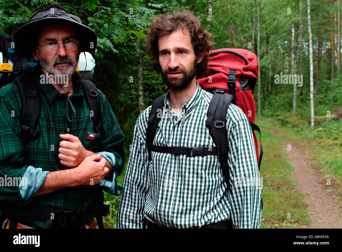 two men with rucksacks hiking in a forest MR Stock Photo - Alamy