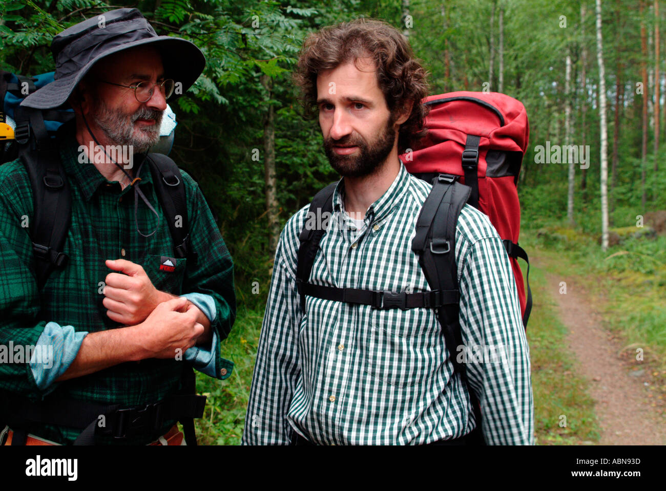 two men with rucksacks hiking in a forest MR Stock Photo - Alamy
